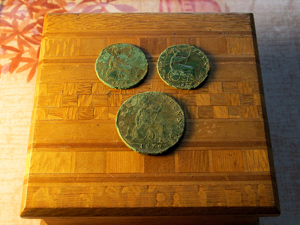 Got a nice old coin spill today. Two half-pennies and a penny. Dates ...